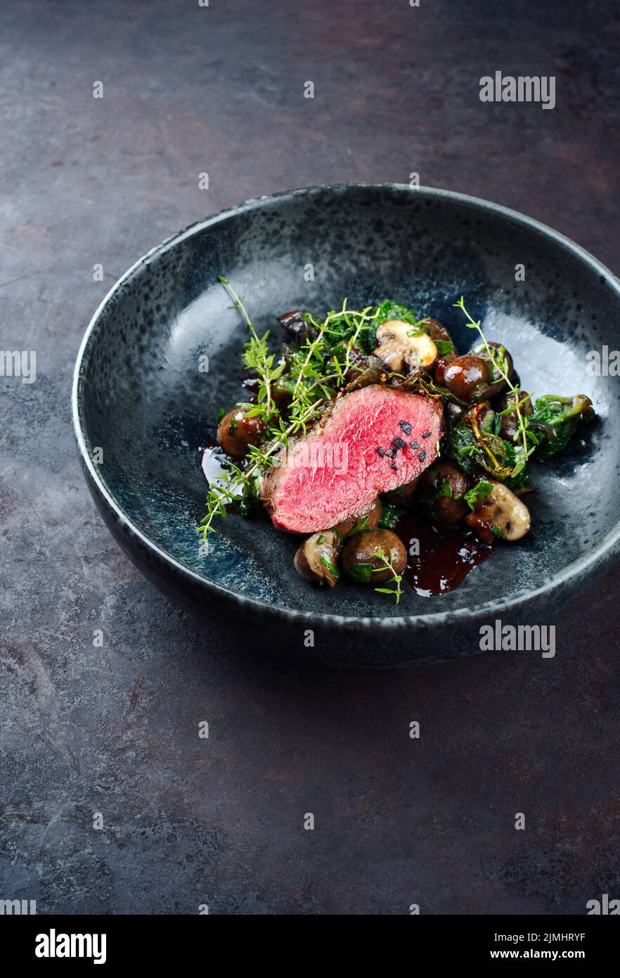 Modern style traditional fried dry aged angus beef filet medaillons ...