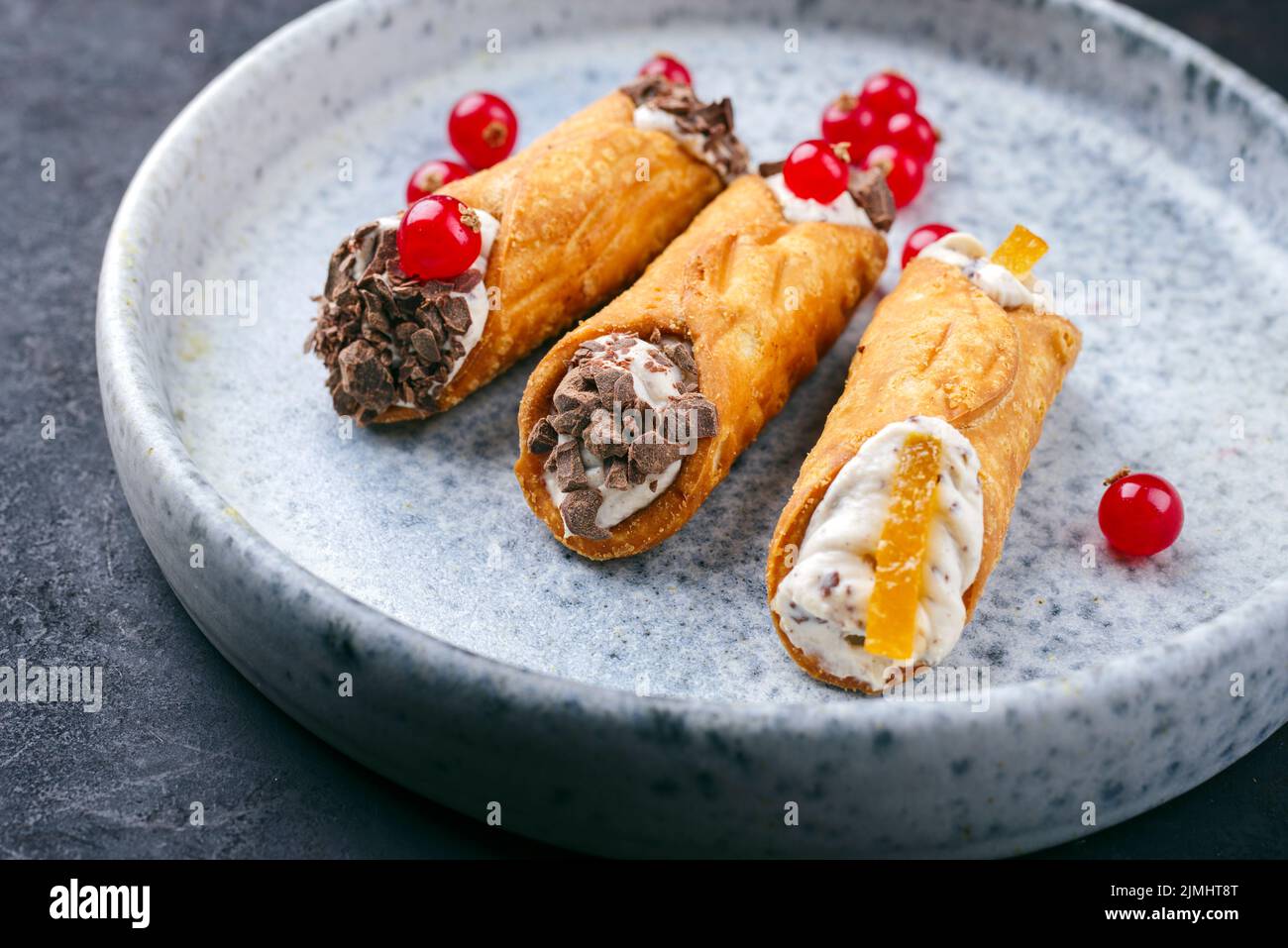 Traditional Italian Sicilian pastry dessert cannoli with creamy ricotta ...