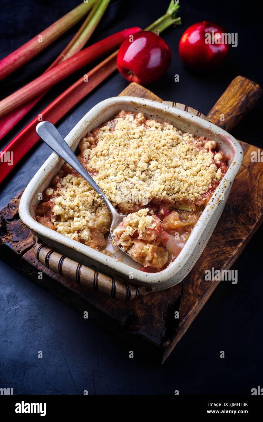 Traditional English crumble cake with rhubarb and apple with backed ...