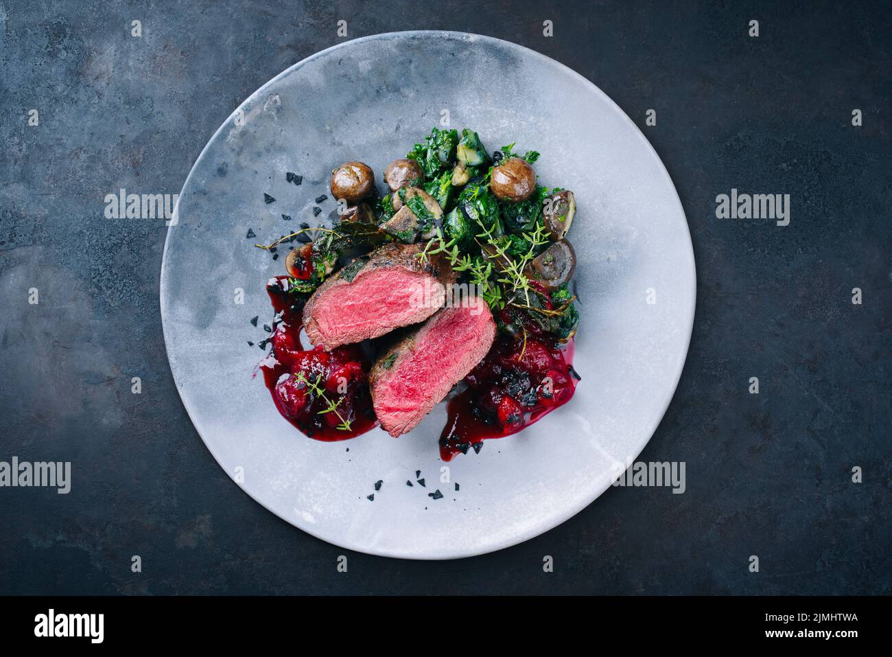 Modern style traditional fried dry aged angus beef filet medaillons ...