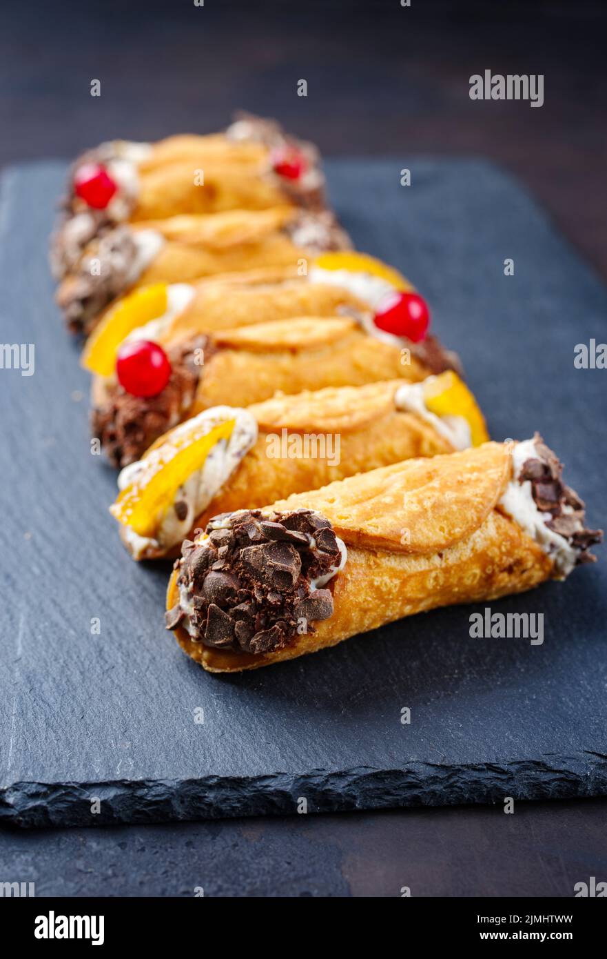 Traditional Italian Sicilian pastry dessert cannoli with creamy ricotta ...