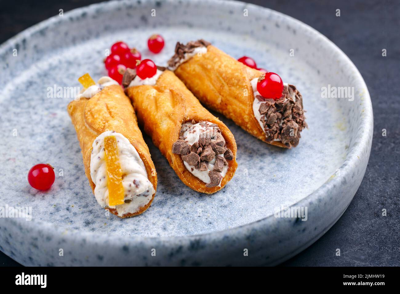 Traditional Italian Sicilian pastry dessert cannoli with creamy ricotta ...