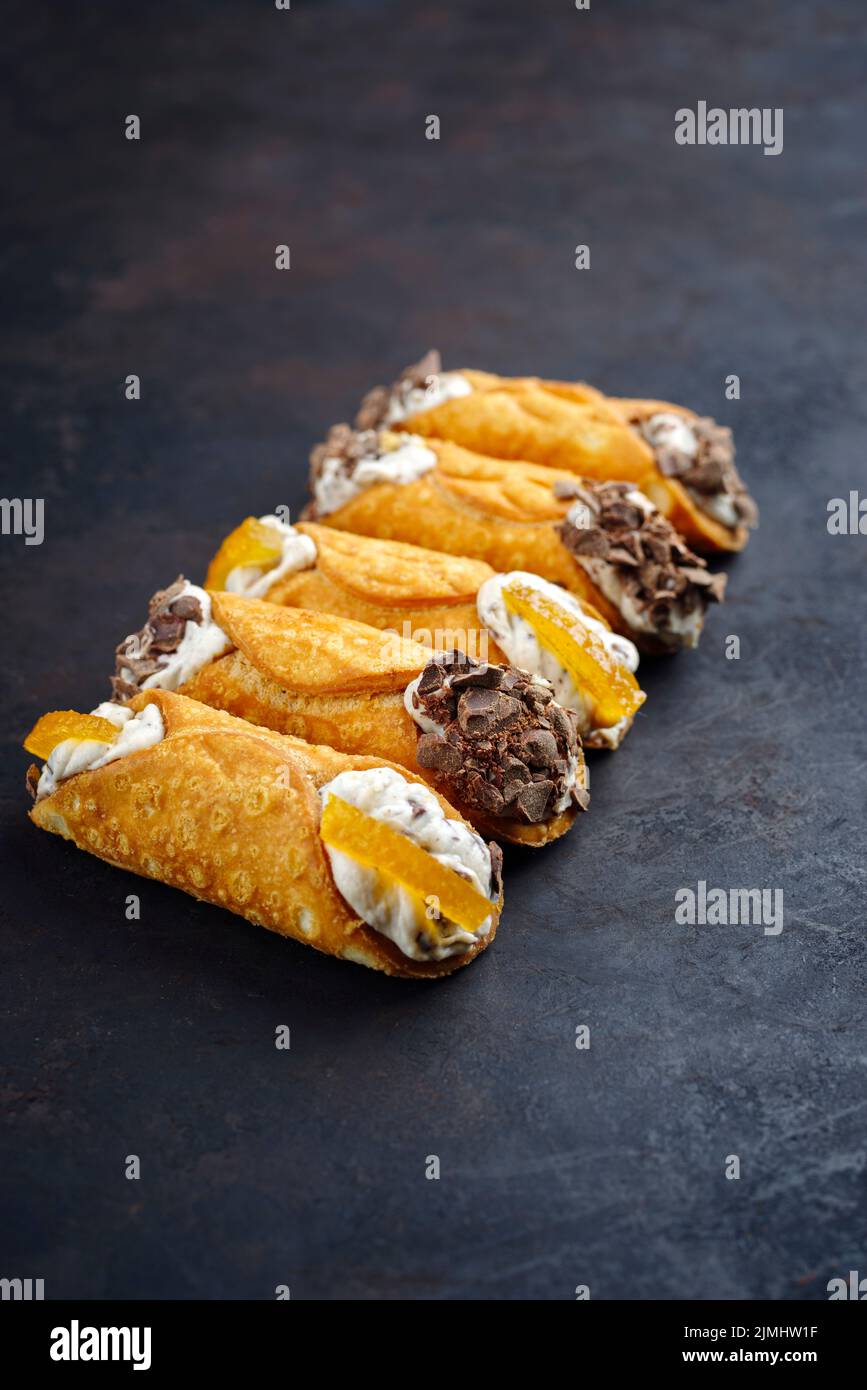 Traditional Italian Sicilian pastry dessert cannoli with creamy ricotta ...