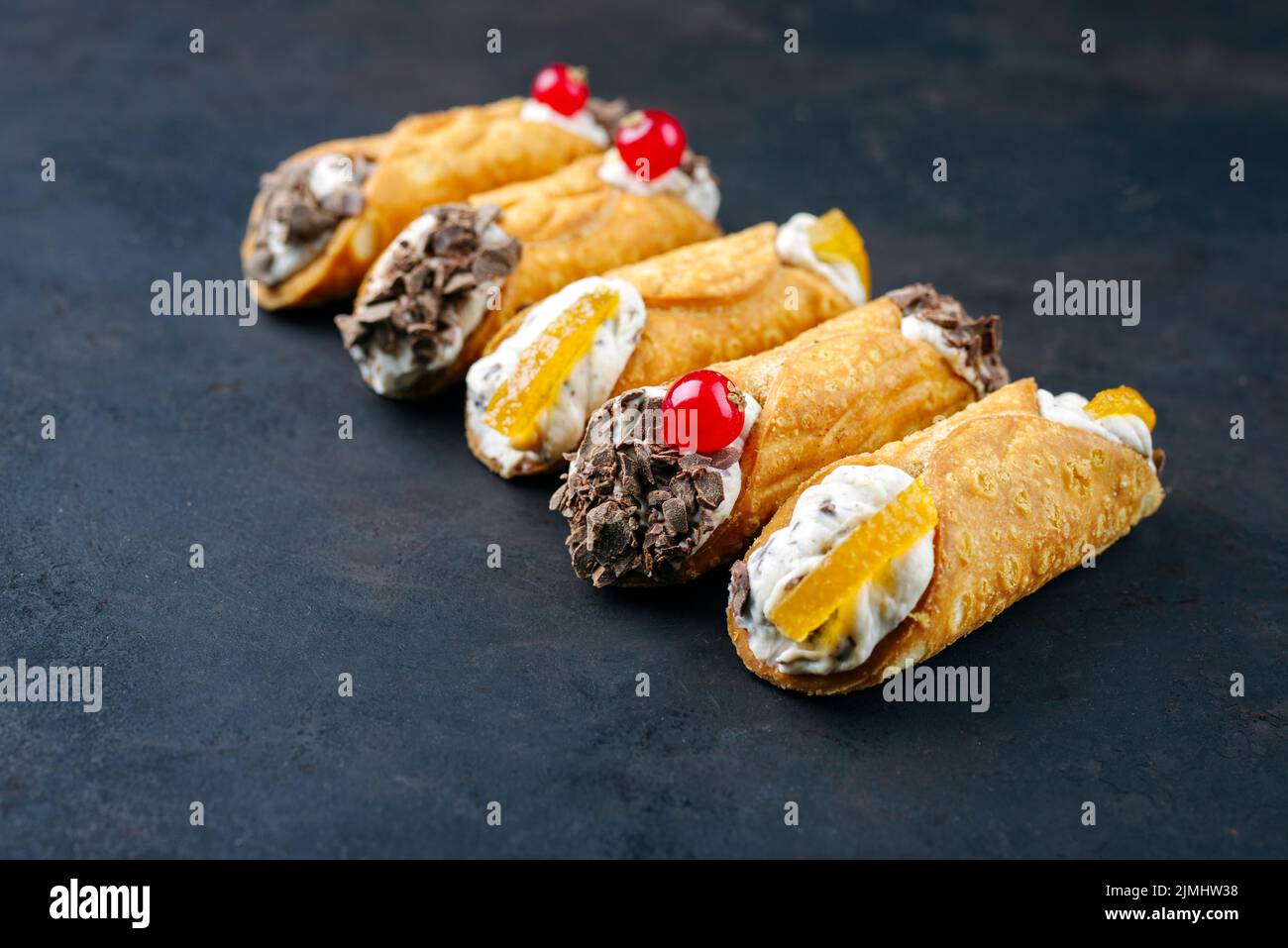 Traditional Italian Sicilian pastry dessert cannoli with creamy ricotta ...