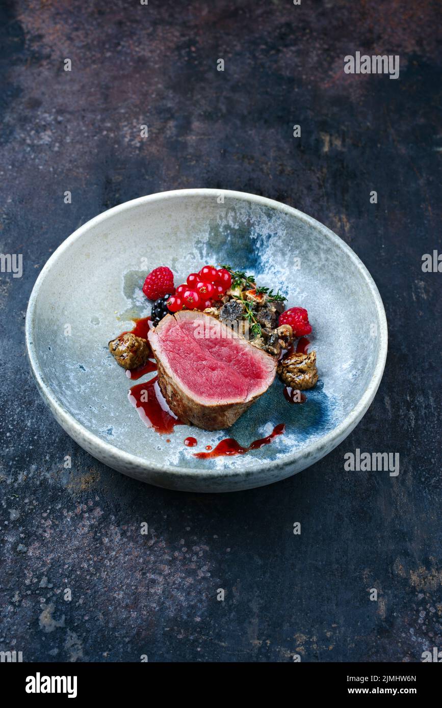 Modern style traditional fried dry aged angus beef filet medaillons ...