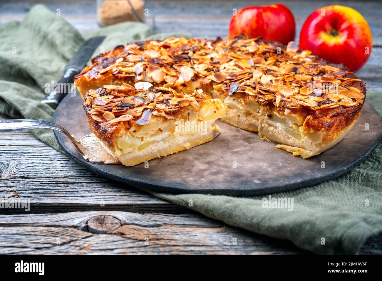 Traditional apple pie torta di mele cremosa with almond flakes served ...