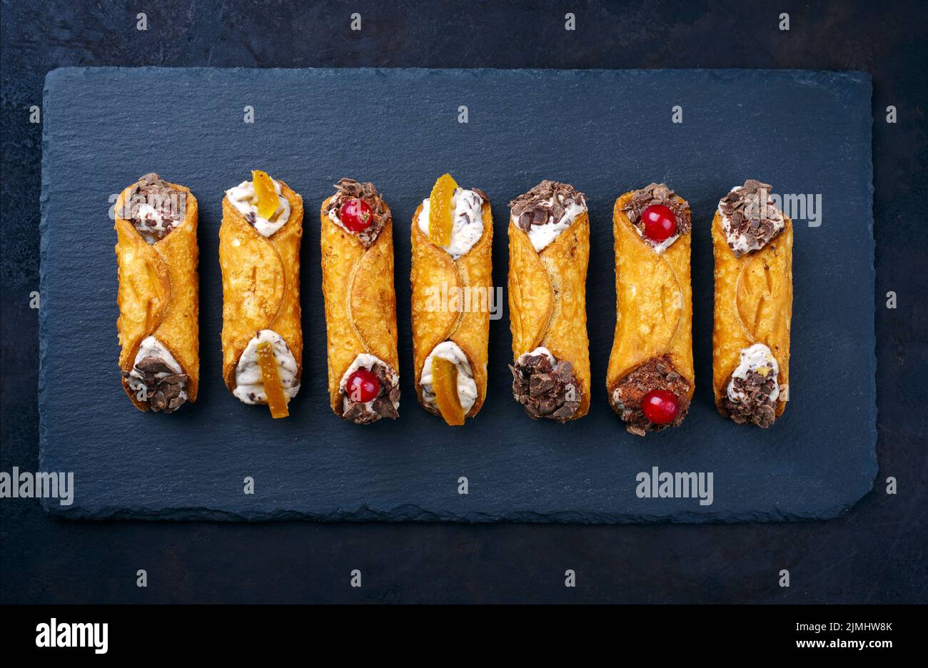 Traditional Italian Sicilian pastry dessert cannoli with creamy ricotta ...