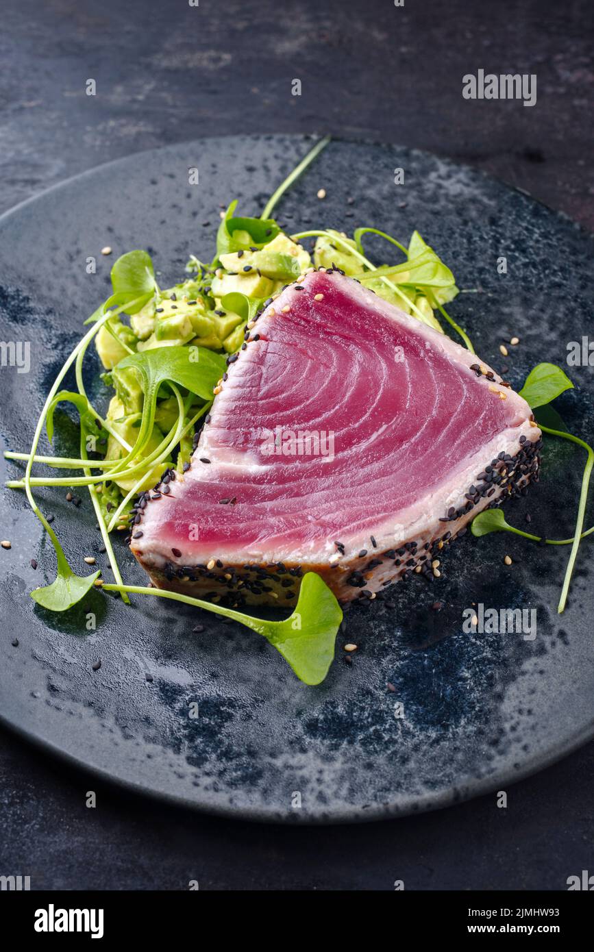 Modern style traditional Japanese gourmet seared tuna fish steak tataki ...