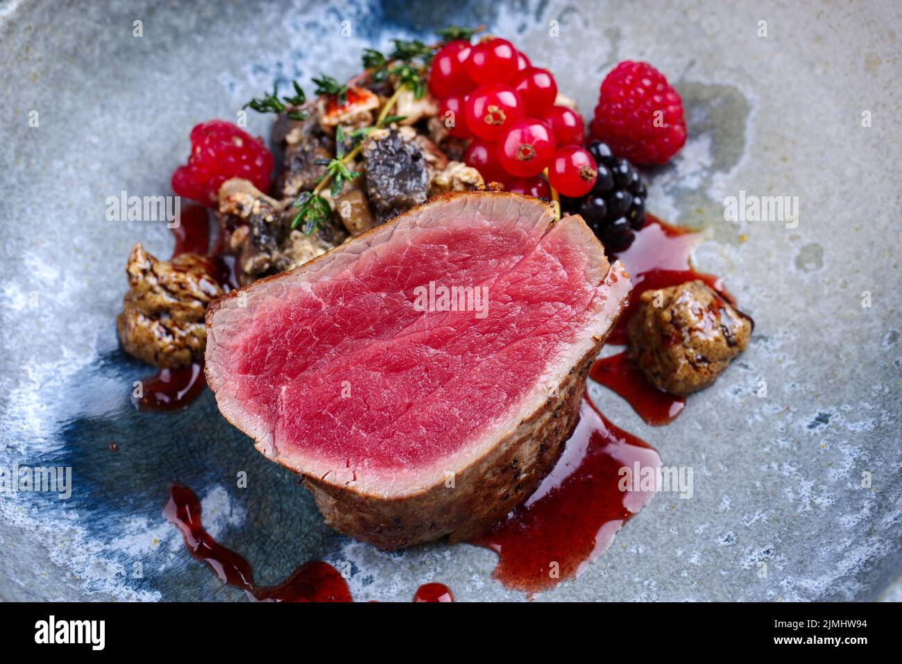 Modern style traditional fried dry aged angus beef filet medaillons ...
