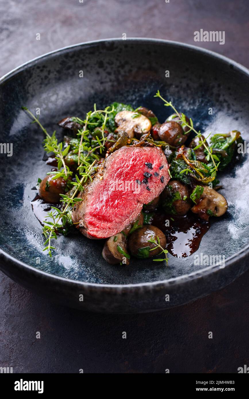 Modern style traditional fried dry aged angus beef filet medaillons ...