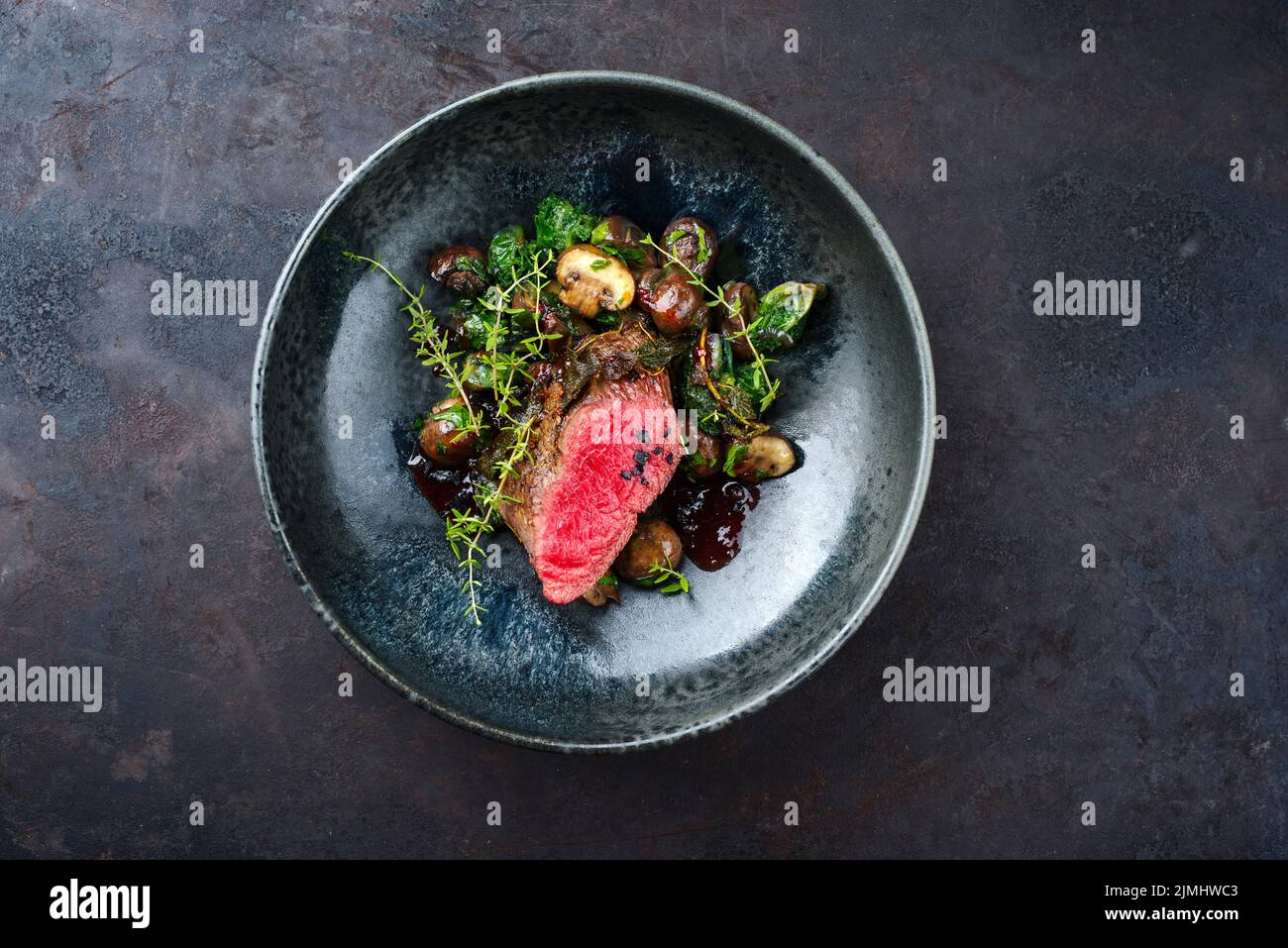 Modern style traditional fried dry aged angus beef filet medaillons ...