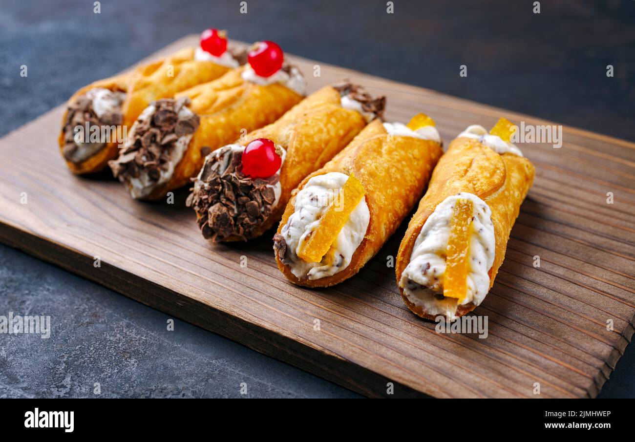 Traditional Italian Sicilian pastry dessert cannoli with creamy ricotta ...