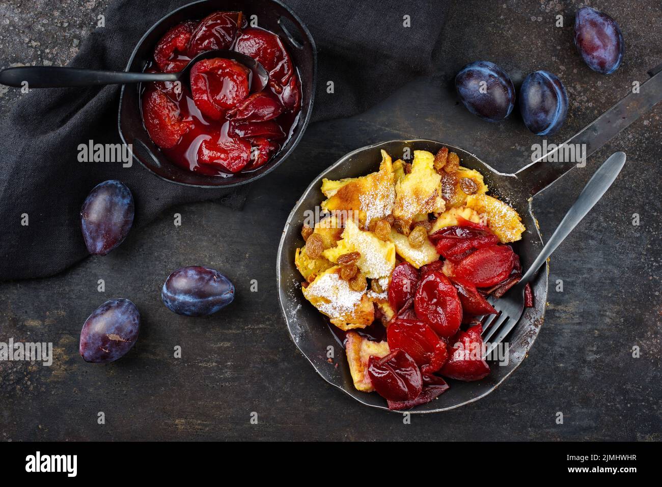 Traditional Austrian Kaiserschmarren with plums and raisins served as a ...