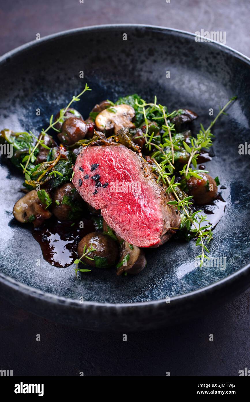 Modern style traditional fried dry aged angus beef filet medaillons ...