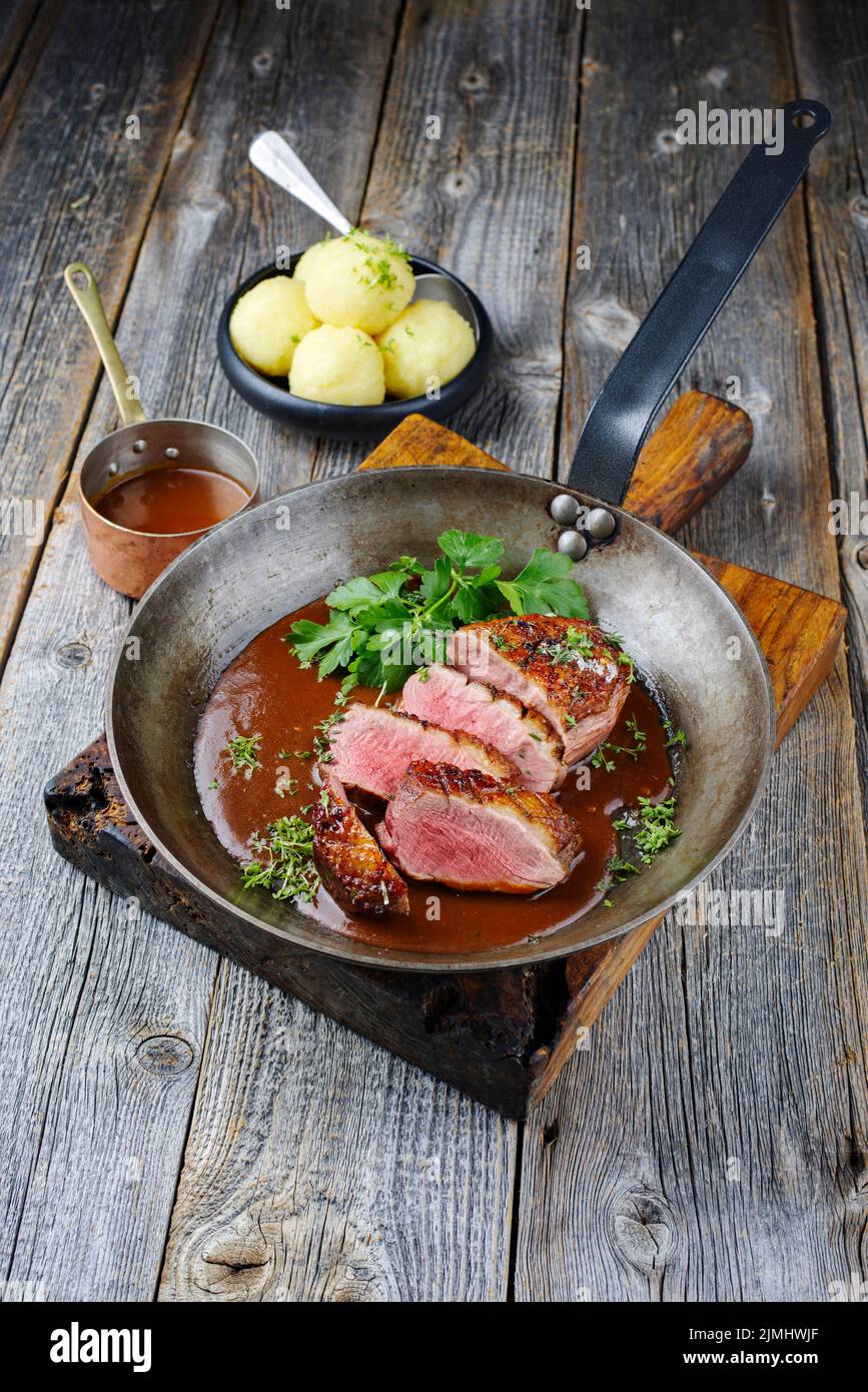 Traditional barbecue gourmet duck breast filet with skin served with ...