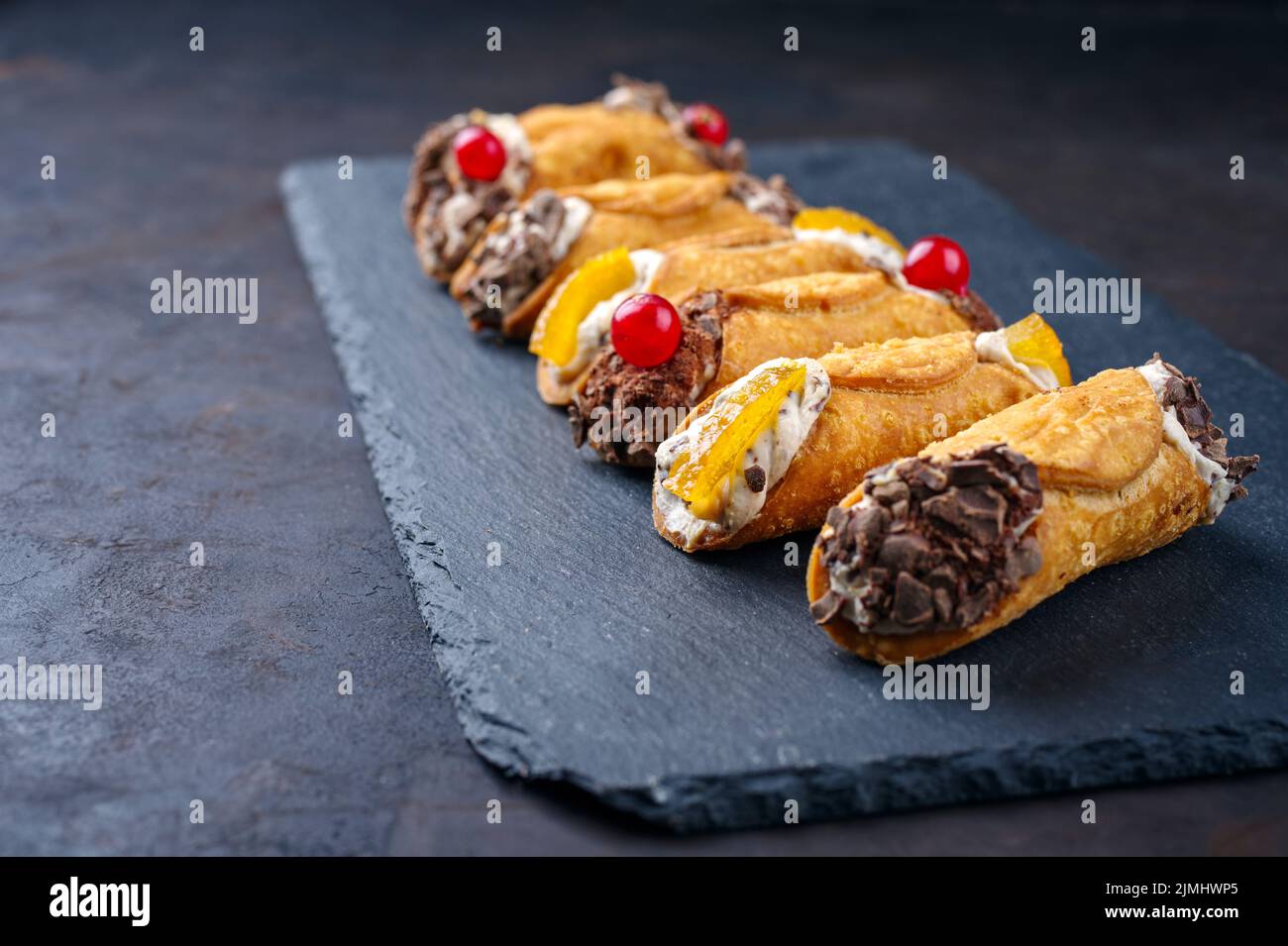 Traditional Italian Sicilian pastry dessert cannoli with creamy ricotta ...