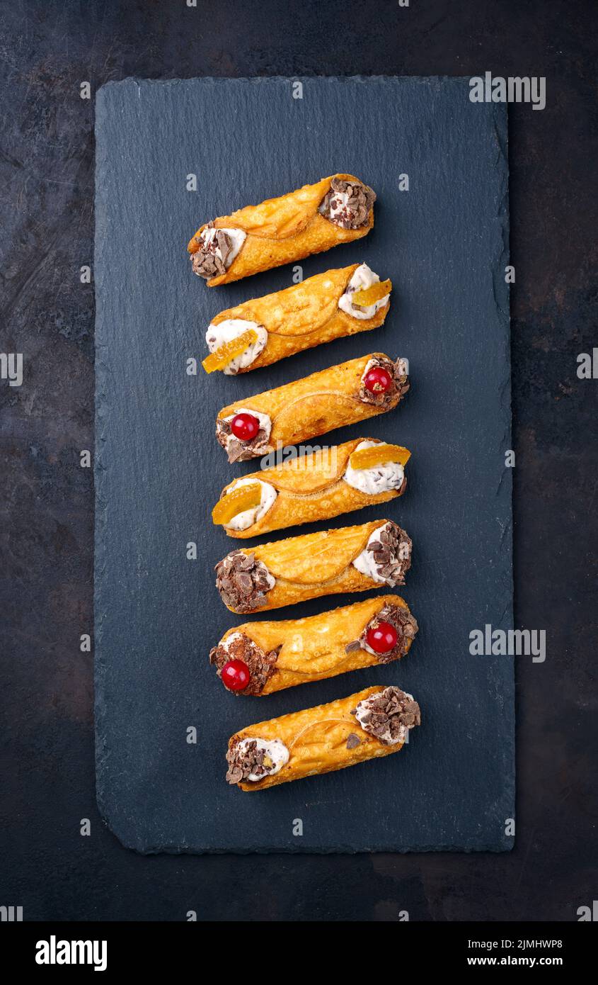 Traditional Italian Sicilian pastry dessert cannoli with creamy ricotta ...