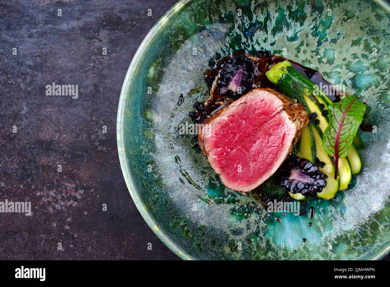 Modern style traditional fried dry aged angus beef filet medaillons ...