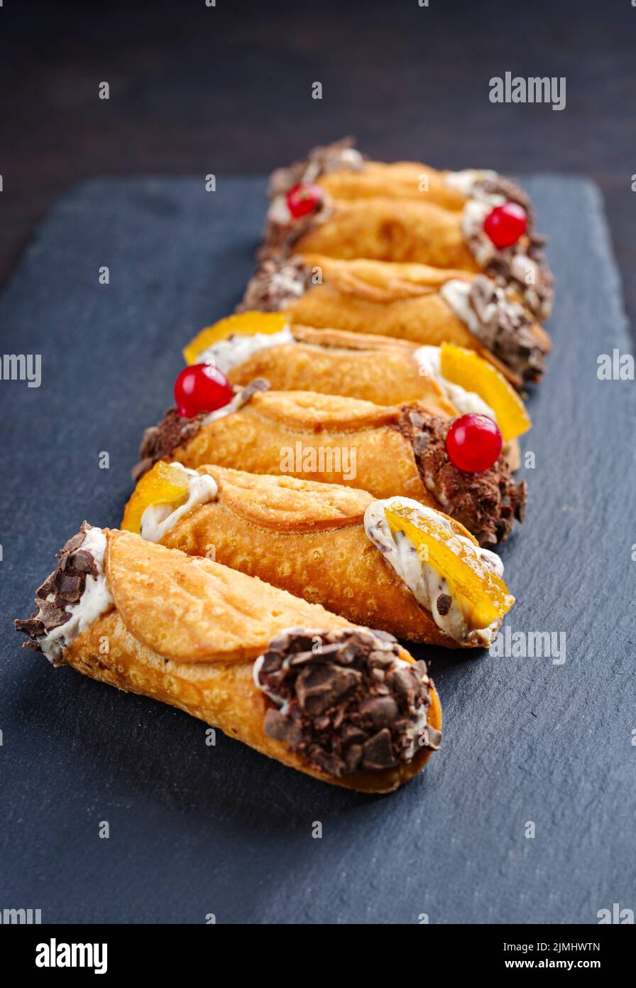 Traditional Italian Sicilian pastry dessert cannoli with creamy ricotta ...