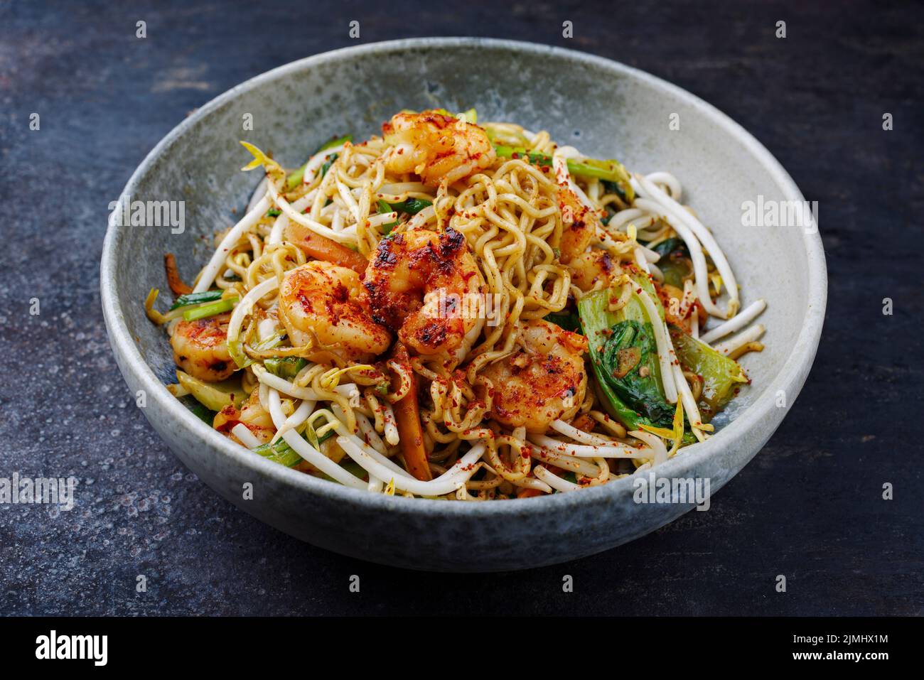 Modern style traditional stir-fried Thai phak kung with king prawns ...