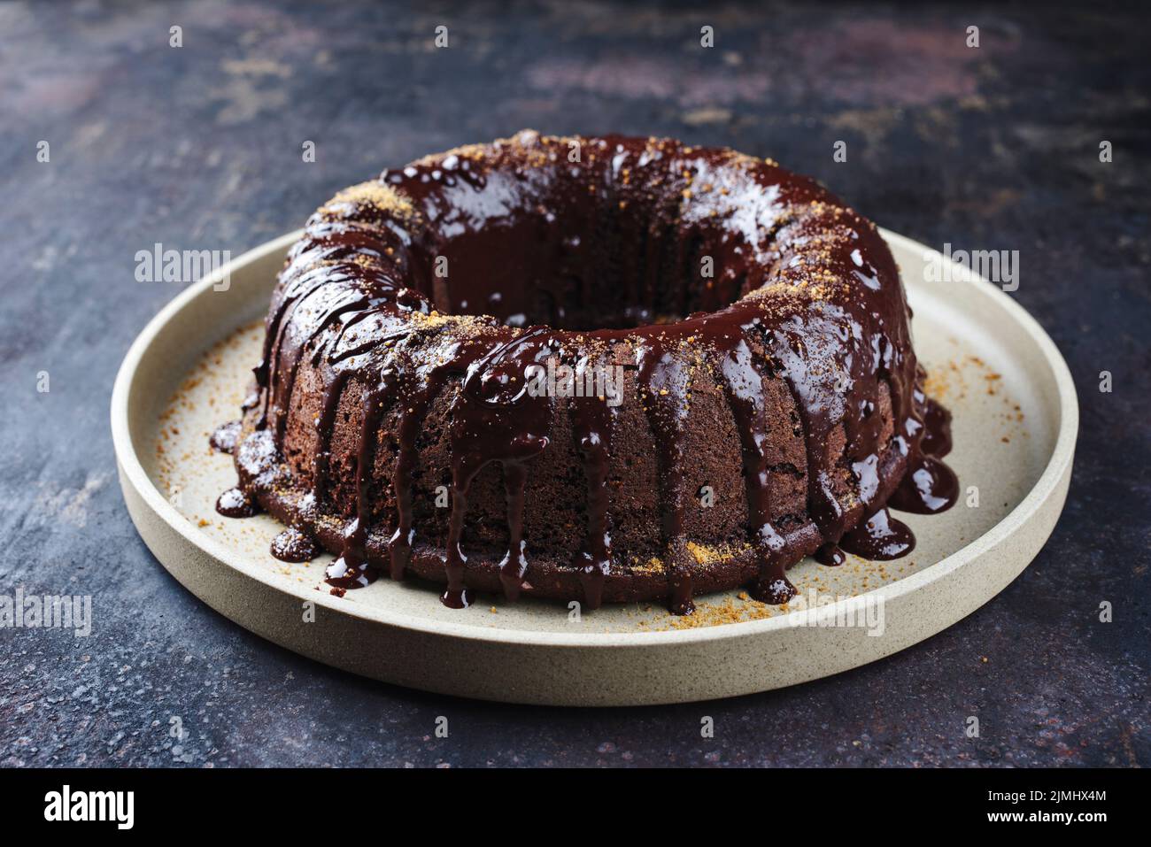 Traditional chocolate bundt cake with icing glaze topping and muscovado ...