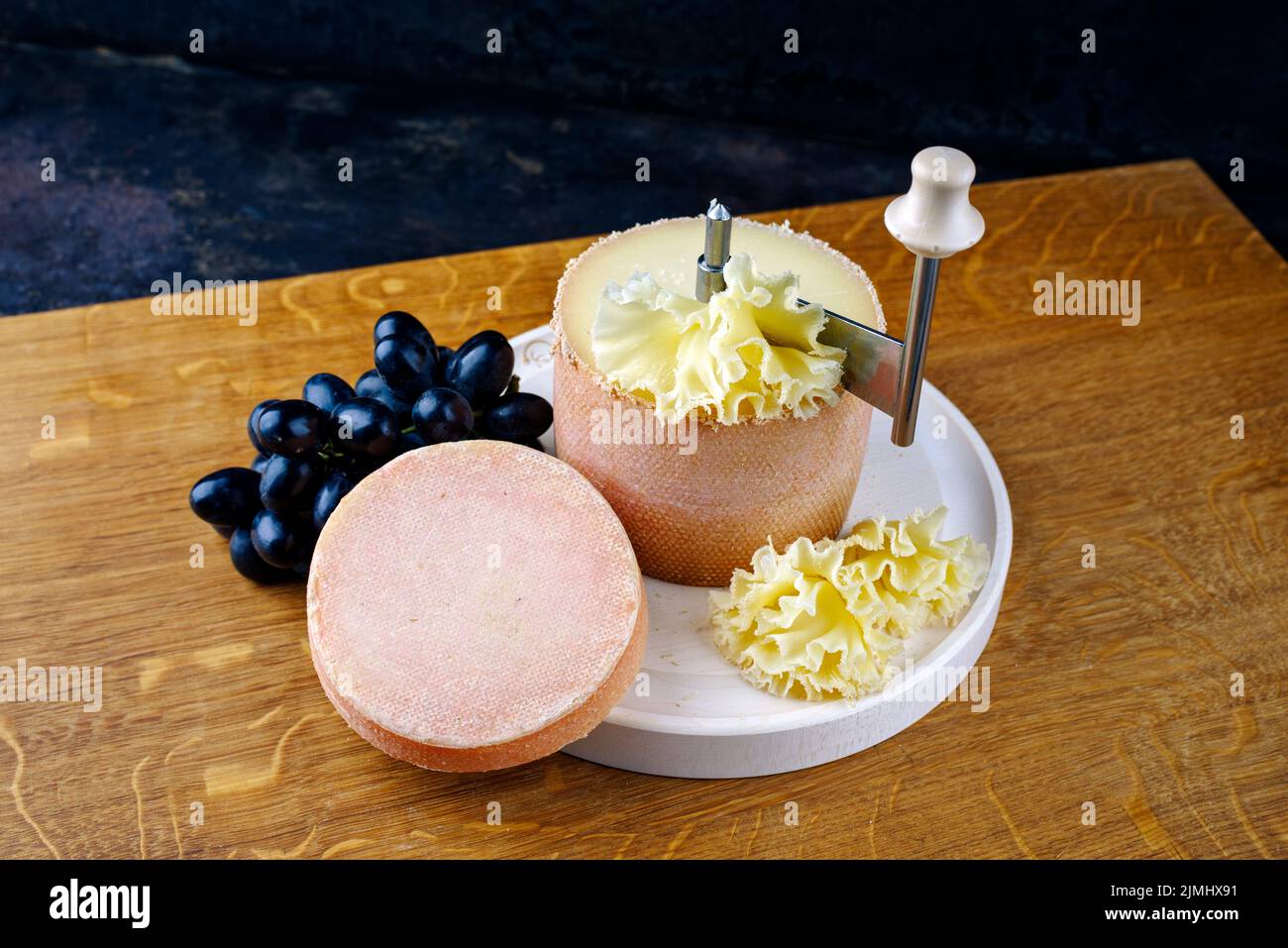 Traditional tete de moine aged mountain cheese of the Alps served with ...