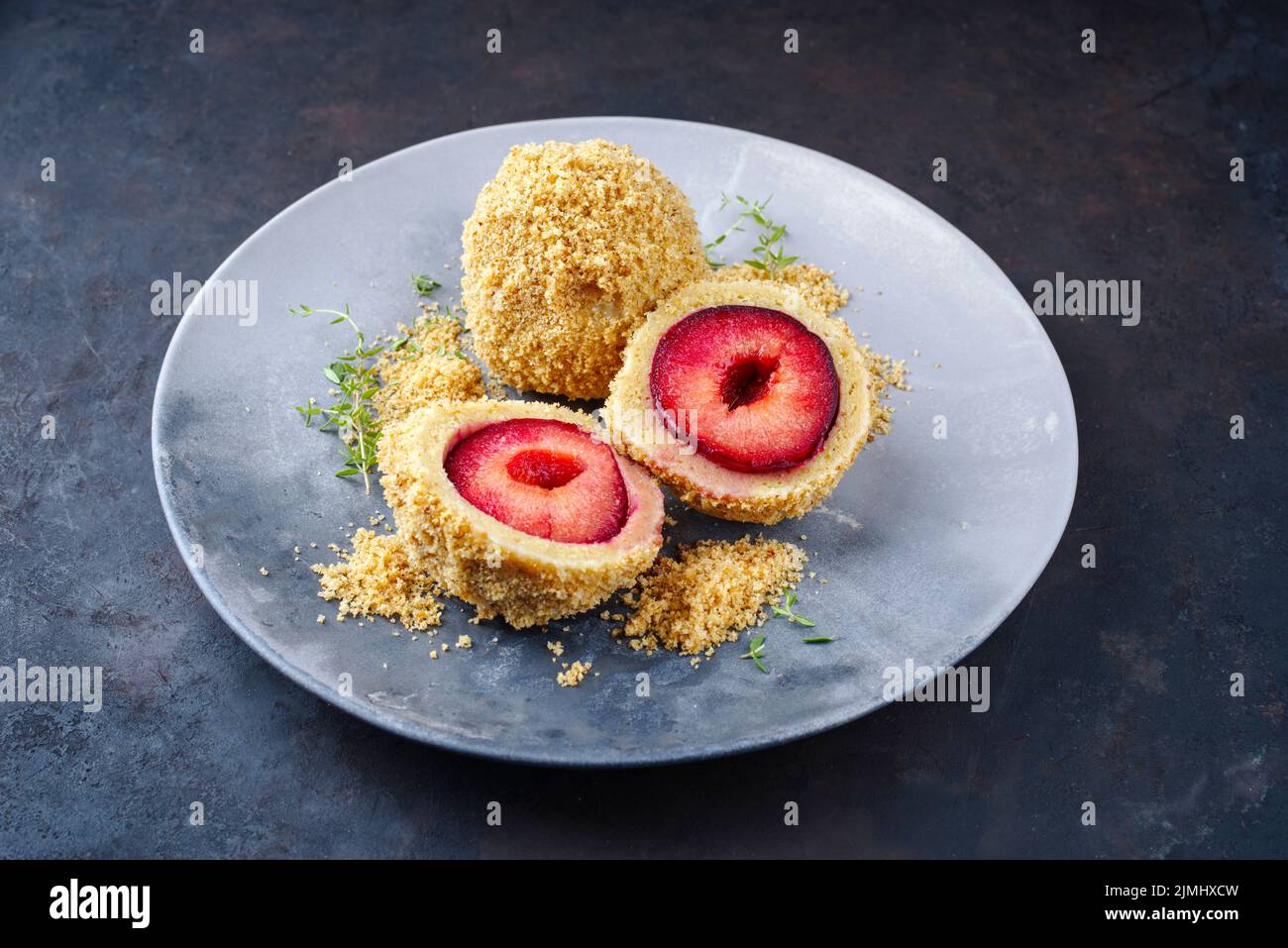 Traditional Austrian plum dumpling with a backed prune in a dough coat ...