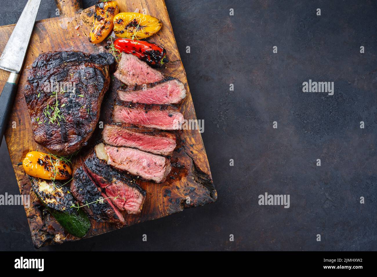 Traditional barbecue dry aged wagyu rib-eye beef steaks served with ...