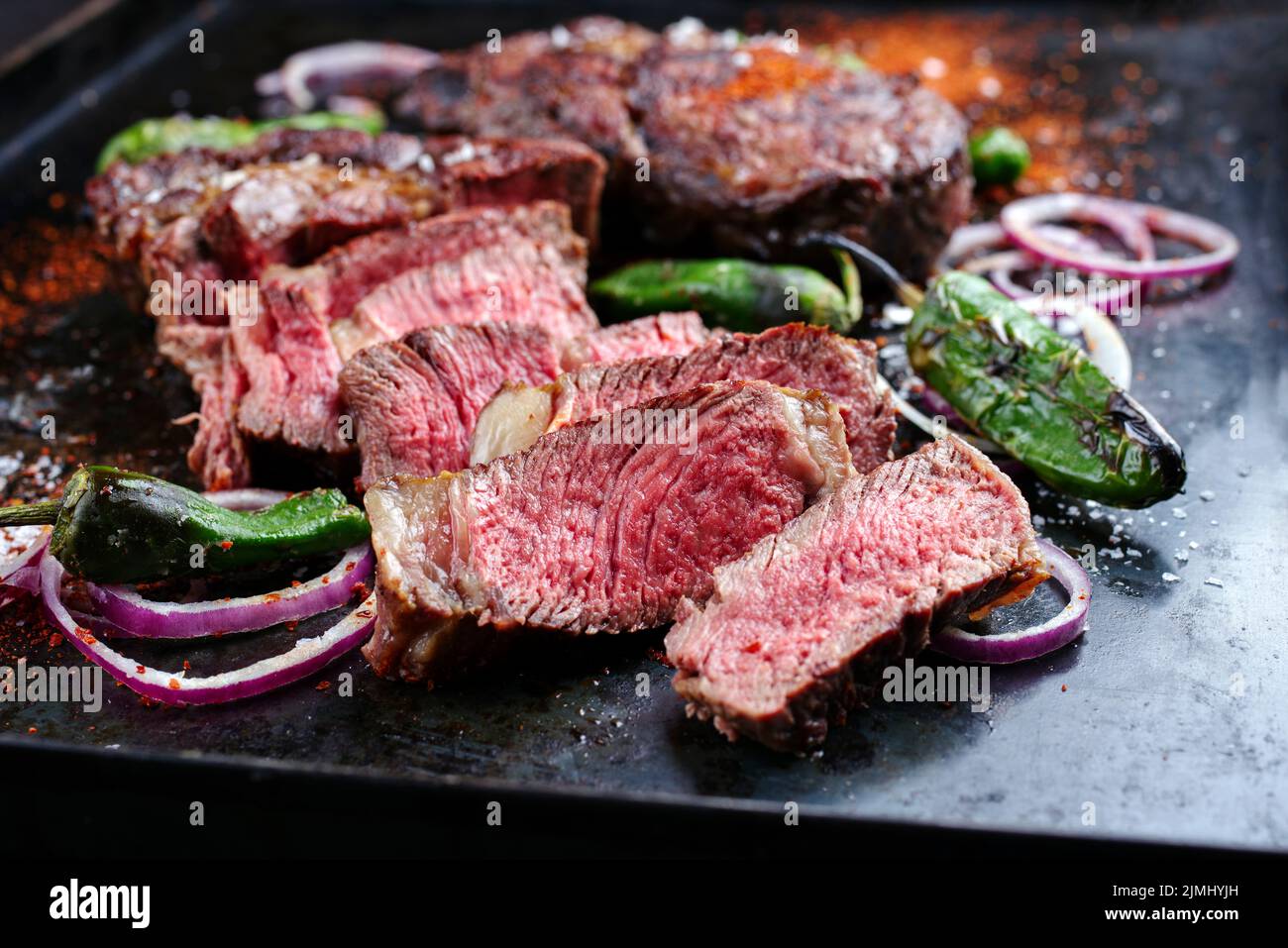 Traditional barbecue dry aged wagyu rib-eye beef steaks served with ...