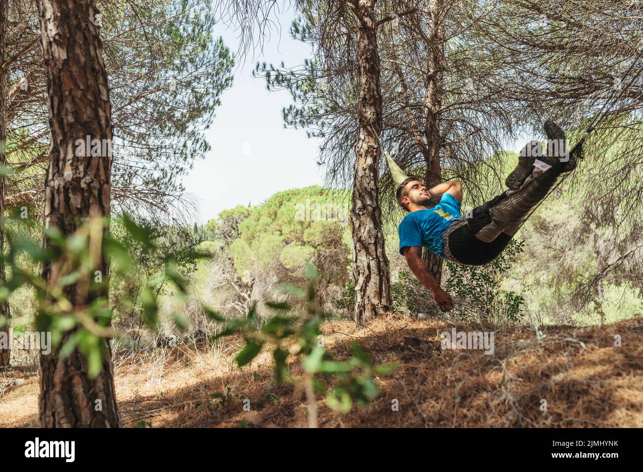 Man taking rest hammock forest Stock Photo - Alamy