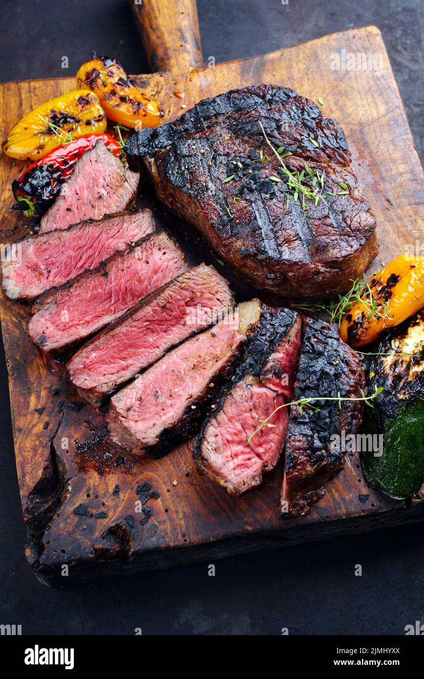 Traditional barbecue dry aged wagyu rib-eye beef steaks served with ...