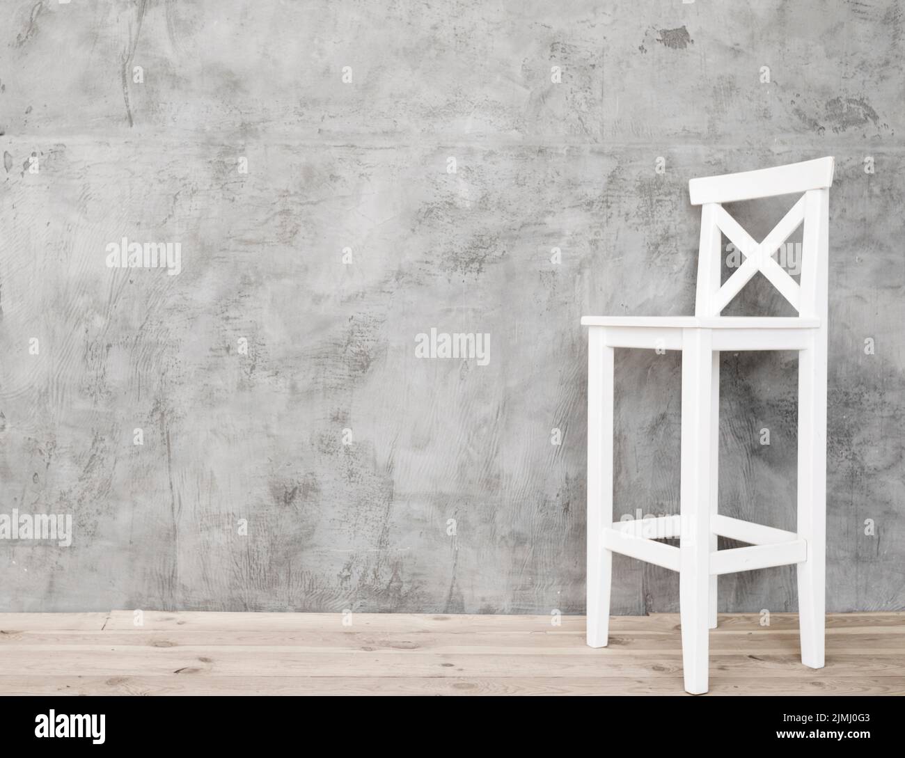 Minimalist white stool with concrete panels Stock Photo - Alamy