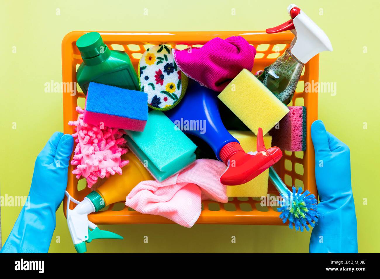 Man holding cleaning supplies hi-res stock photography and images - Alamy