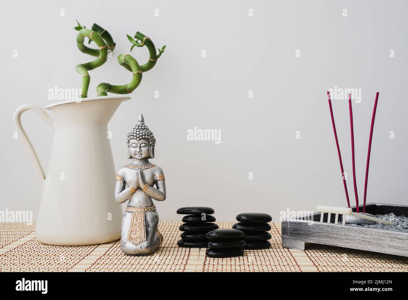 Relaxing composition with buddha figure Stock Photo - Alamy