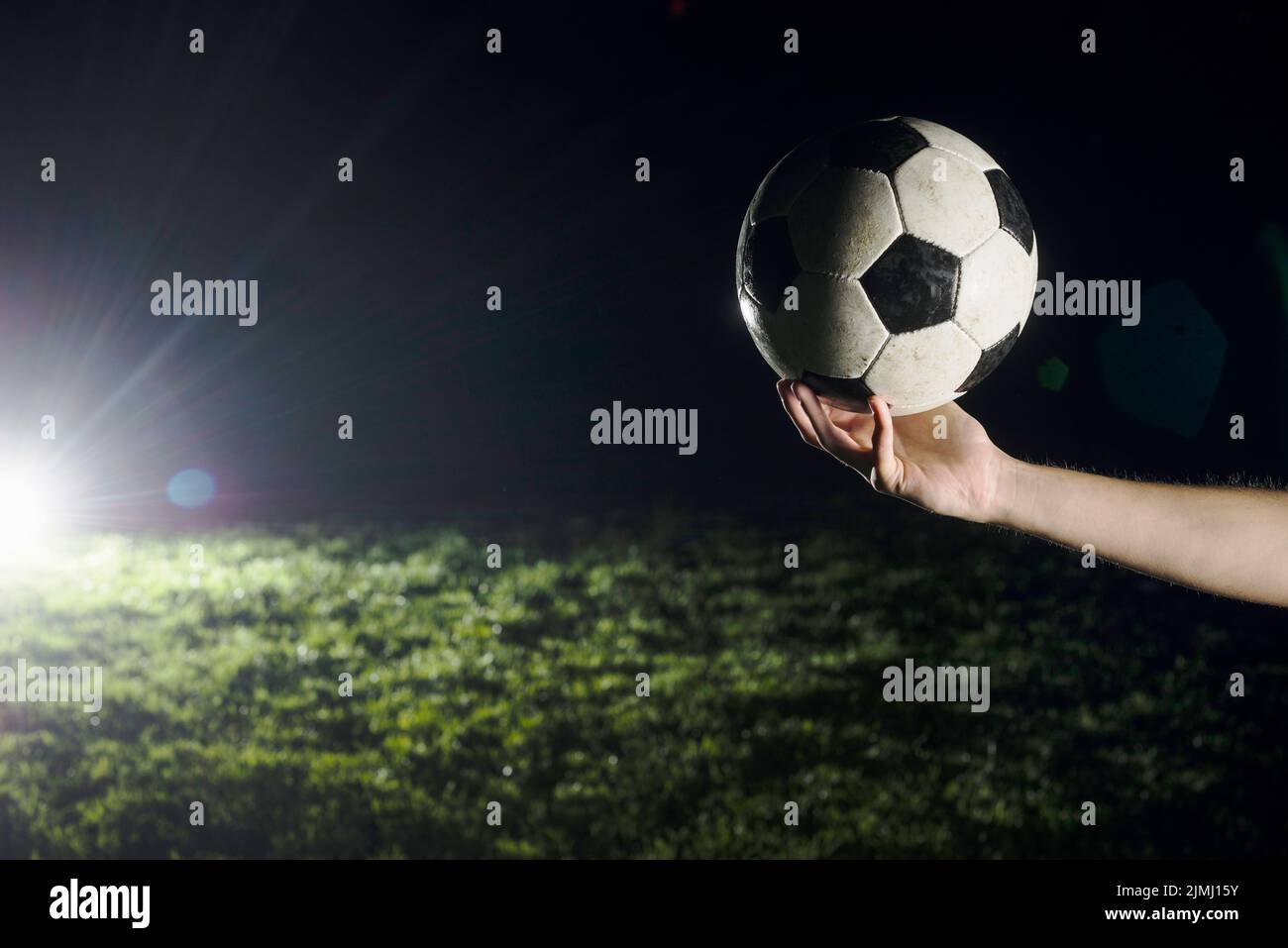 Crop hand with soccer ball Stock Photo - Alamy