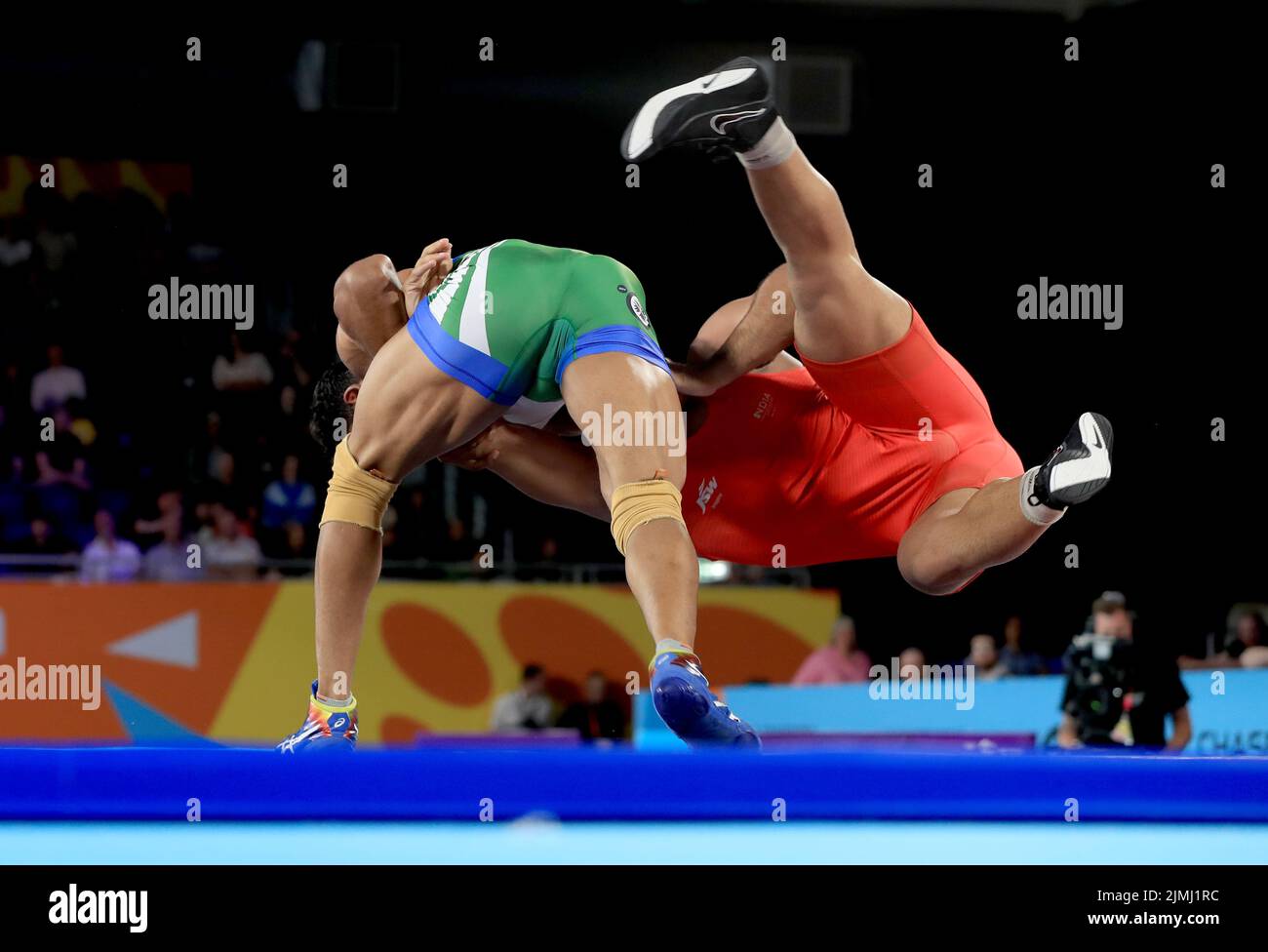 India’s Deepak Nehra competes against Pakistan’s Tayab Raza in the Men ...