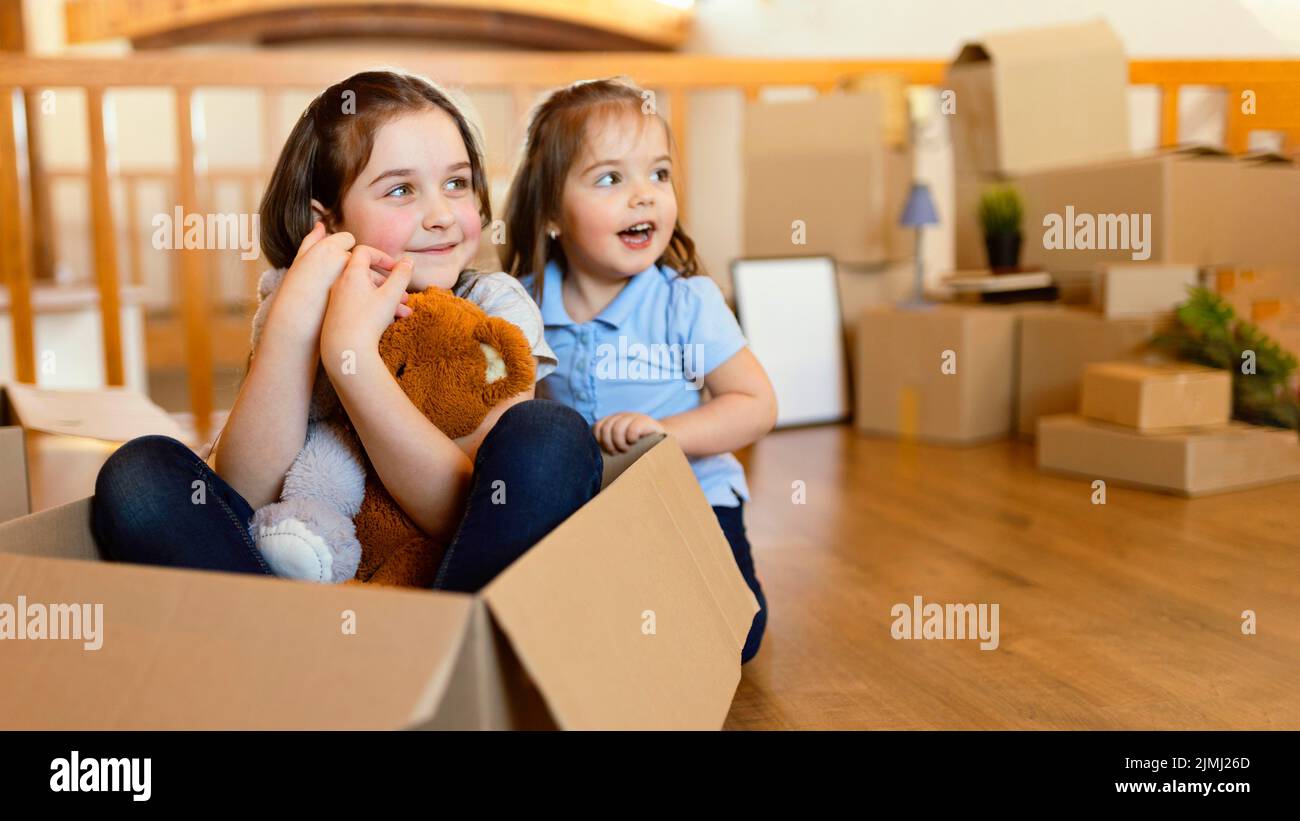 Smiley kids with box toys Stock Photo - Alamy