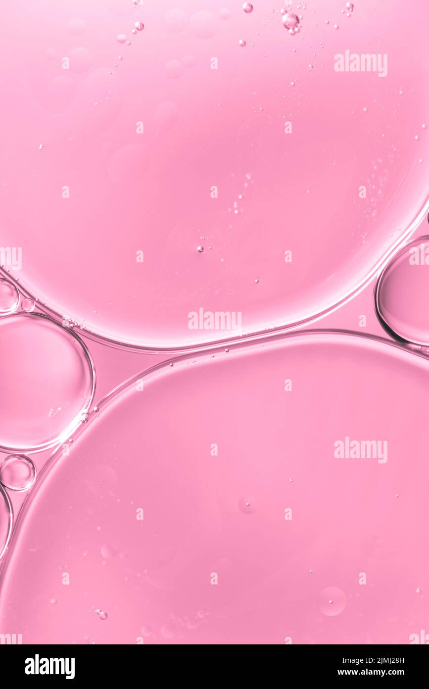 Translucent oil drops water soft pink blurred background Stock Photo ...