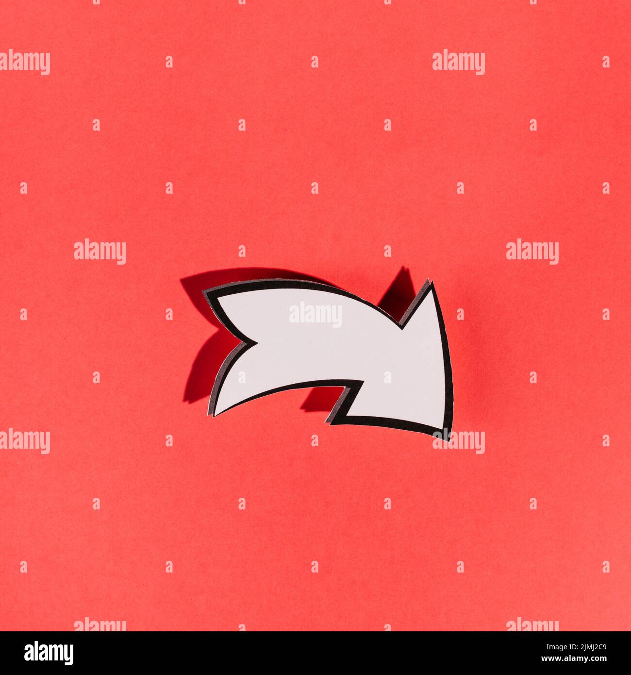 White directional arrow red background Stock Photo - Alamy