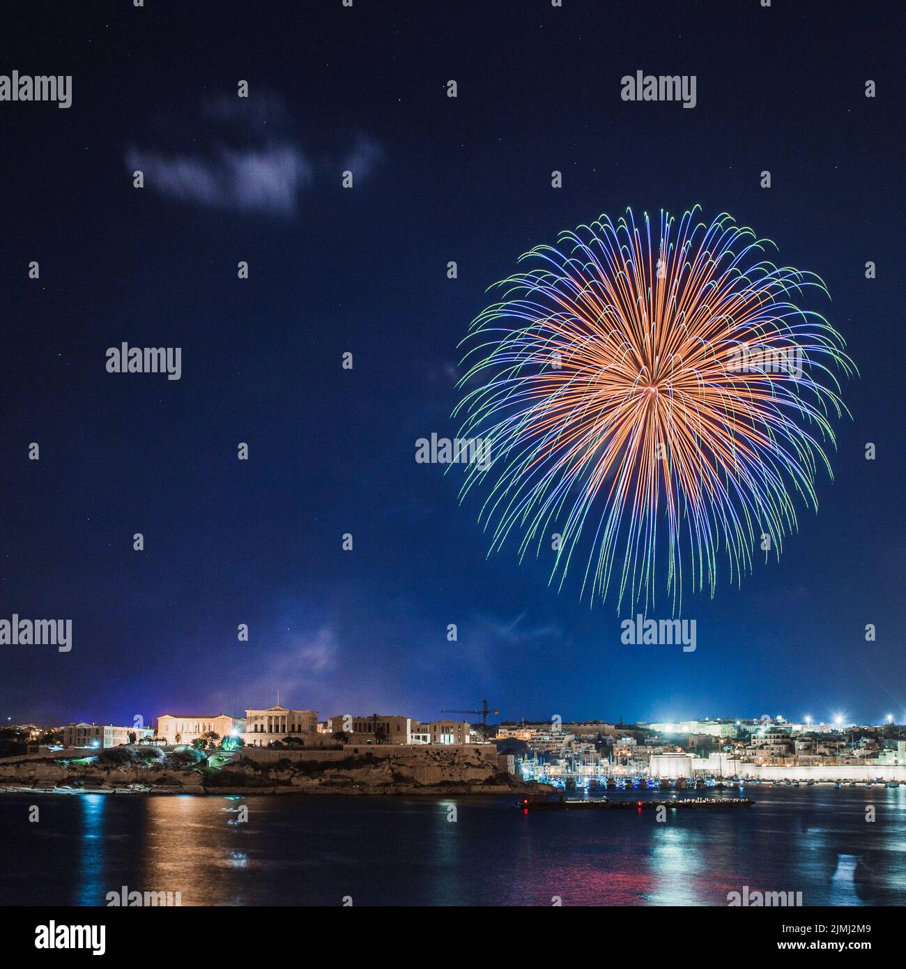 Coastal town with fireworks Stock Photo - Alamy