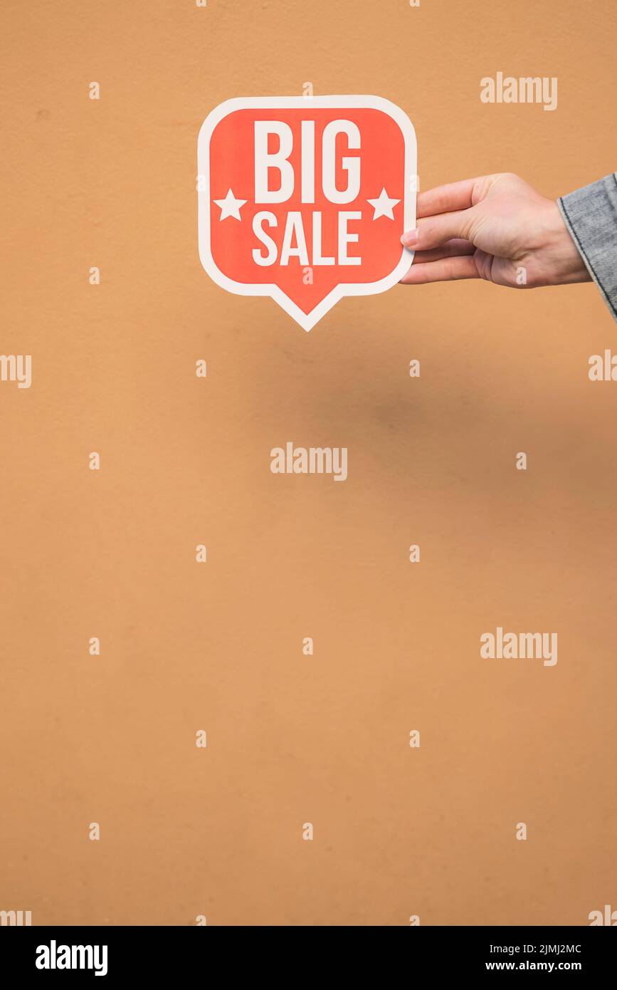 Person holding red sign Stock Photo - Alamy