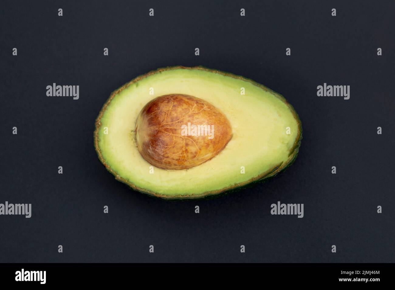 Top view avocado half with pit Stock Photo - Alamy