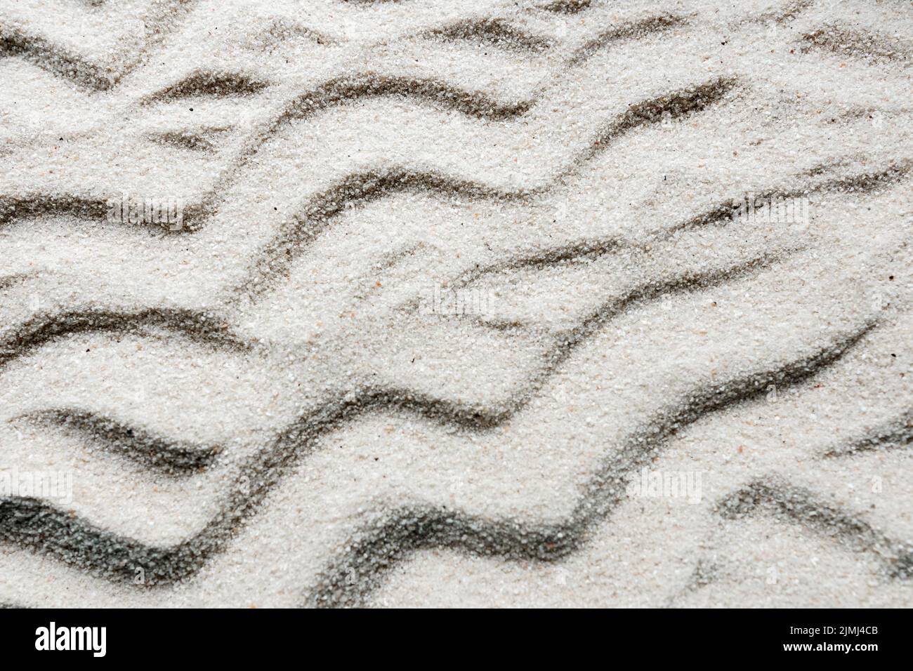 Close up sand with wavy lines Stock Photo - Alamy