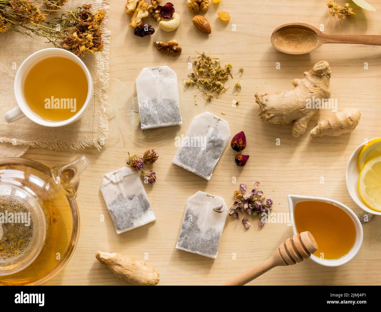 Flat lay natural medicinal herbs with tea Stock Photo - Alamy