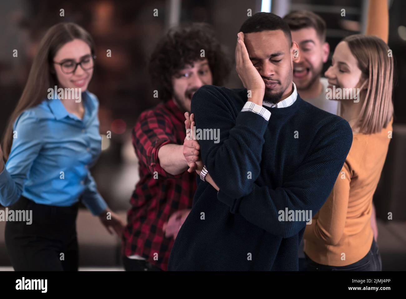 A group of young business people have fun playing interesting games ...