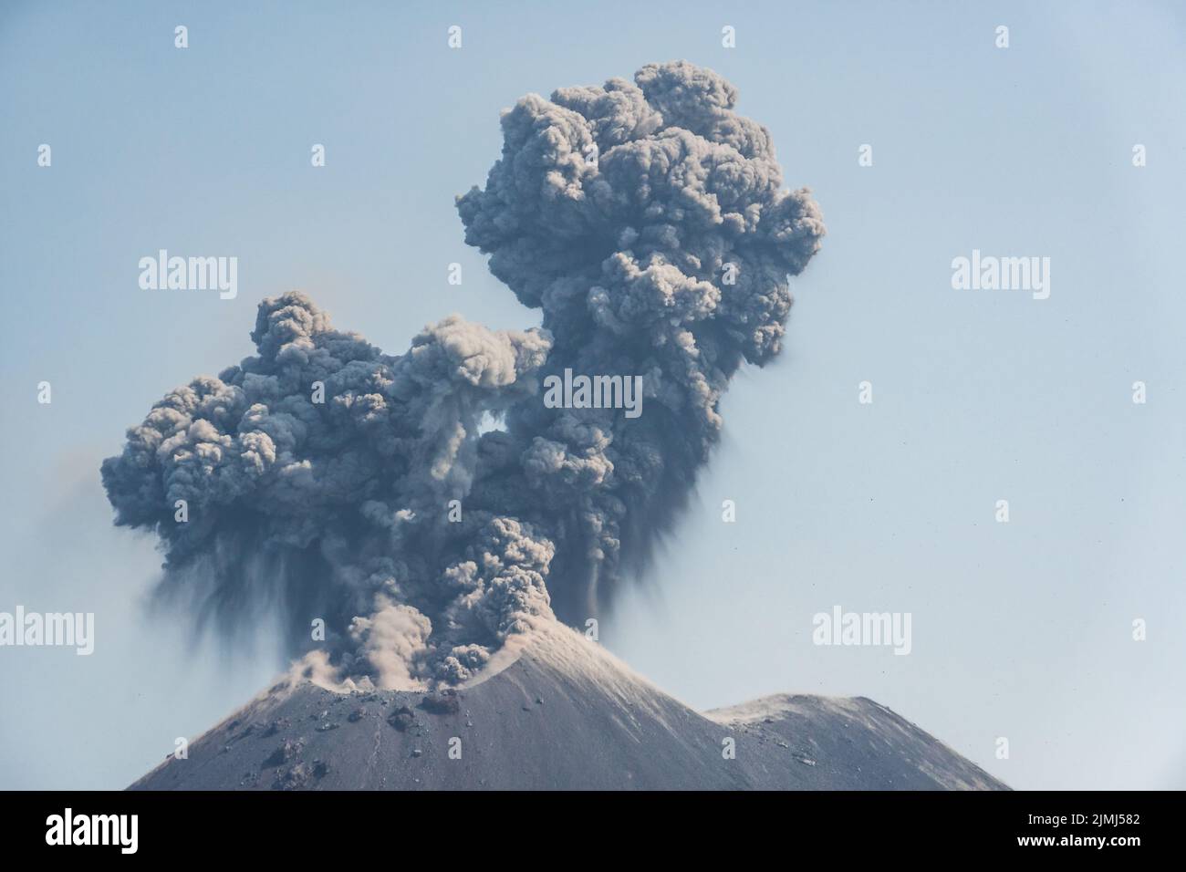 A scenery of a volcano erupting hazardous gases to the sky Stock Photo ...