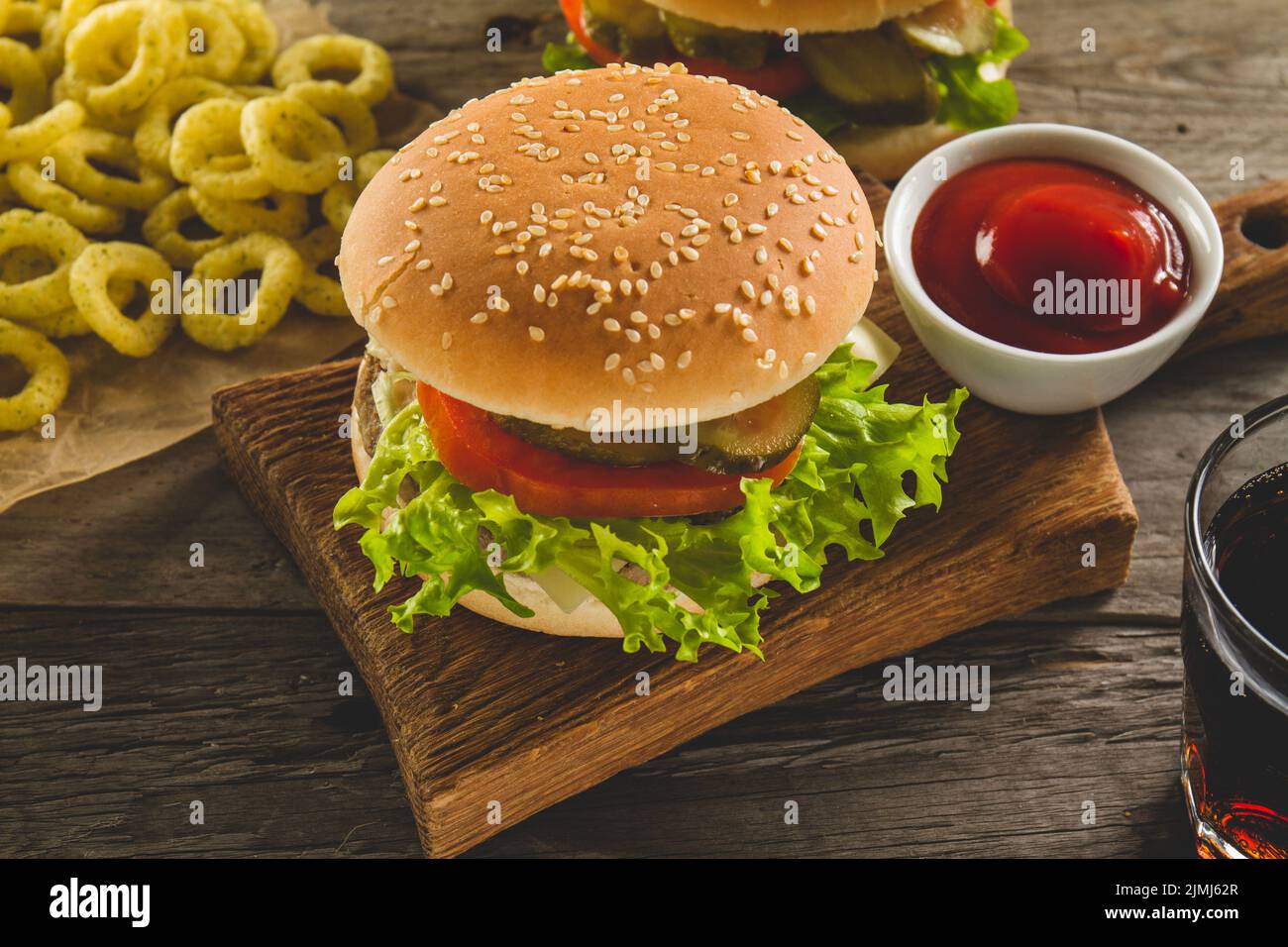 Fast food menu with delicious hamburger Stock Photo - Alamy