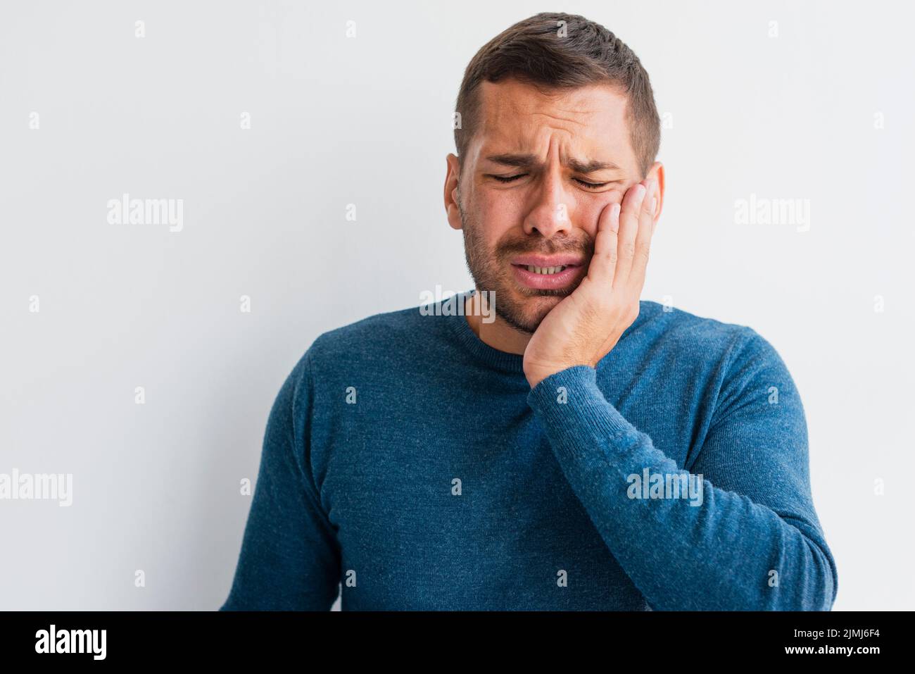 Man depression holding face hi-res stock photography and images - Alamy