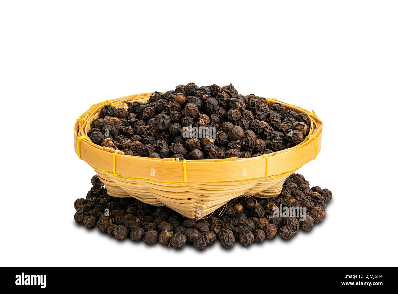 Pile of black pepper seeds in bamboo basket on black pepper seeds on ...