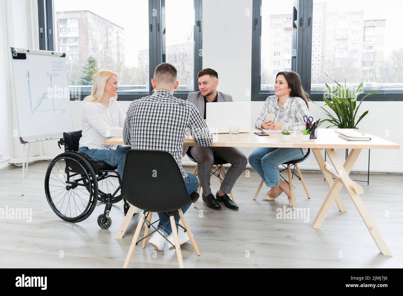 Meeting office with woman wheelchair Stock Photo - Alamy